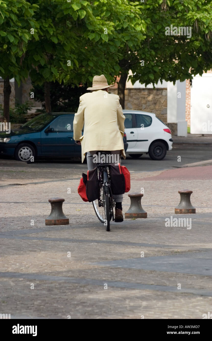 Elegant mature gentleman on bicycle wear pastel yellow blazer and straw ...