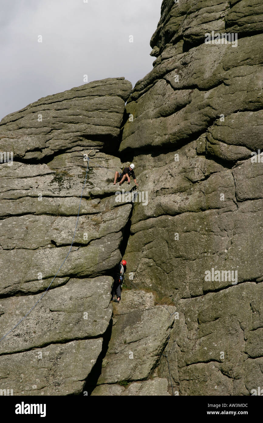 climber Haytor rock Dartmoor National Park Devon England Britain UK ...