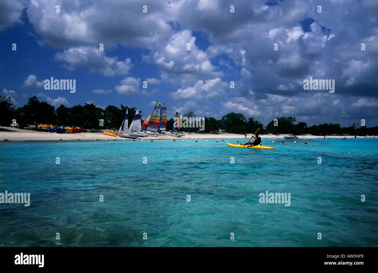 Kayaking near beach with yachts at holiday resort coast of Cuba Stock ...