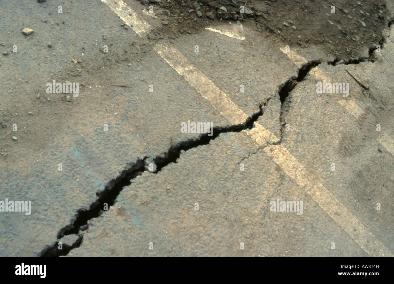 Cracked road surface; Ellar Ghyll, Otley, West Yorkshire, England, UK ...