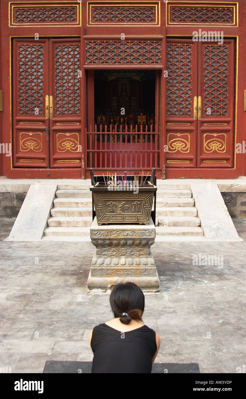 Chinese Woman Praying At Yonghe Gong Temple, Beijing Stock Photo - Alamy