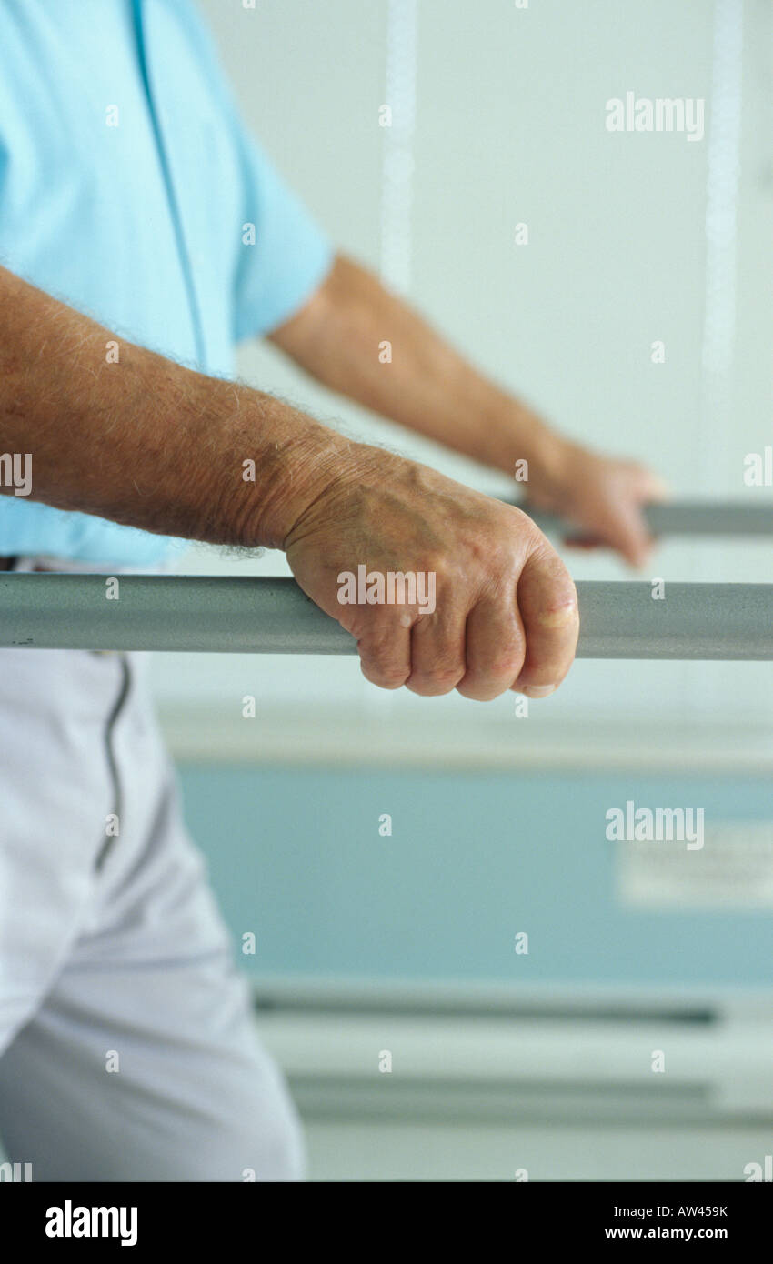 Physiotherapy on the parallel bars Stock Photo - Alamy