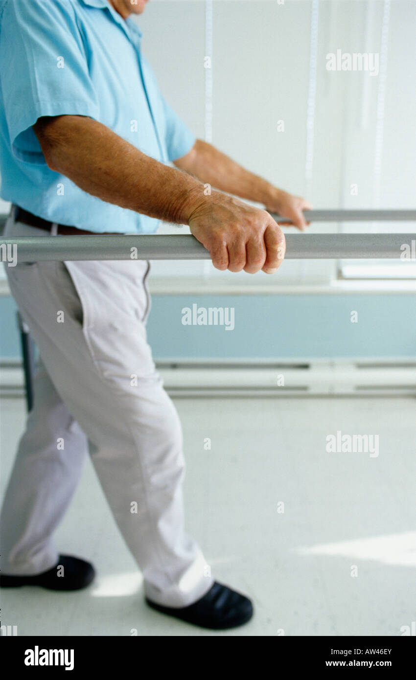 Patient using the walking parallel bars as rehabilitation Stock Photo ...