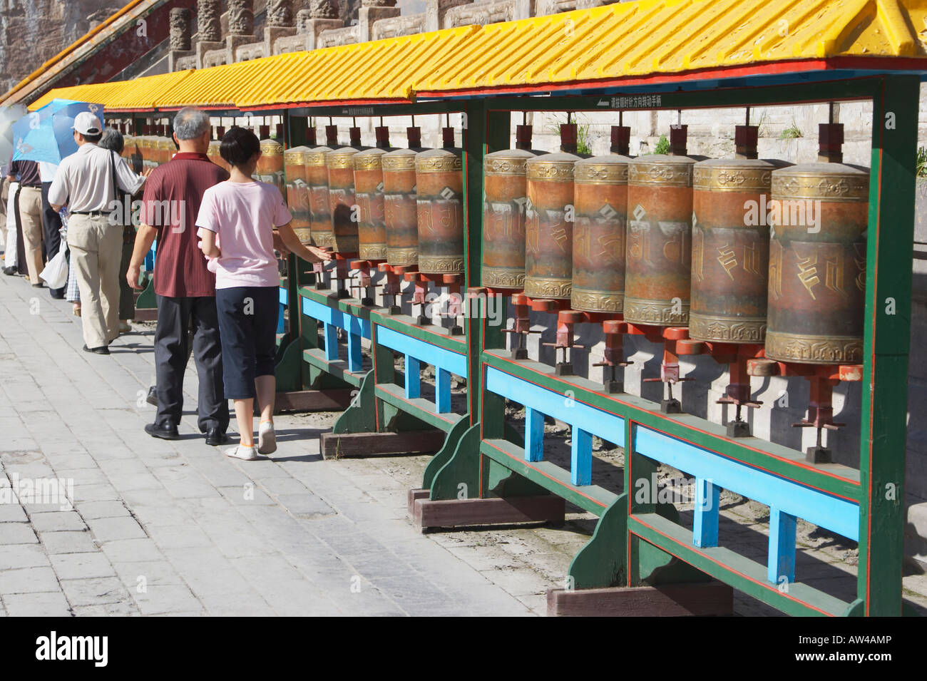 People Passing Prayer Wheels At Puning Si, Chengde Stock Photo - Alamy