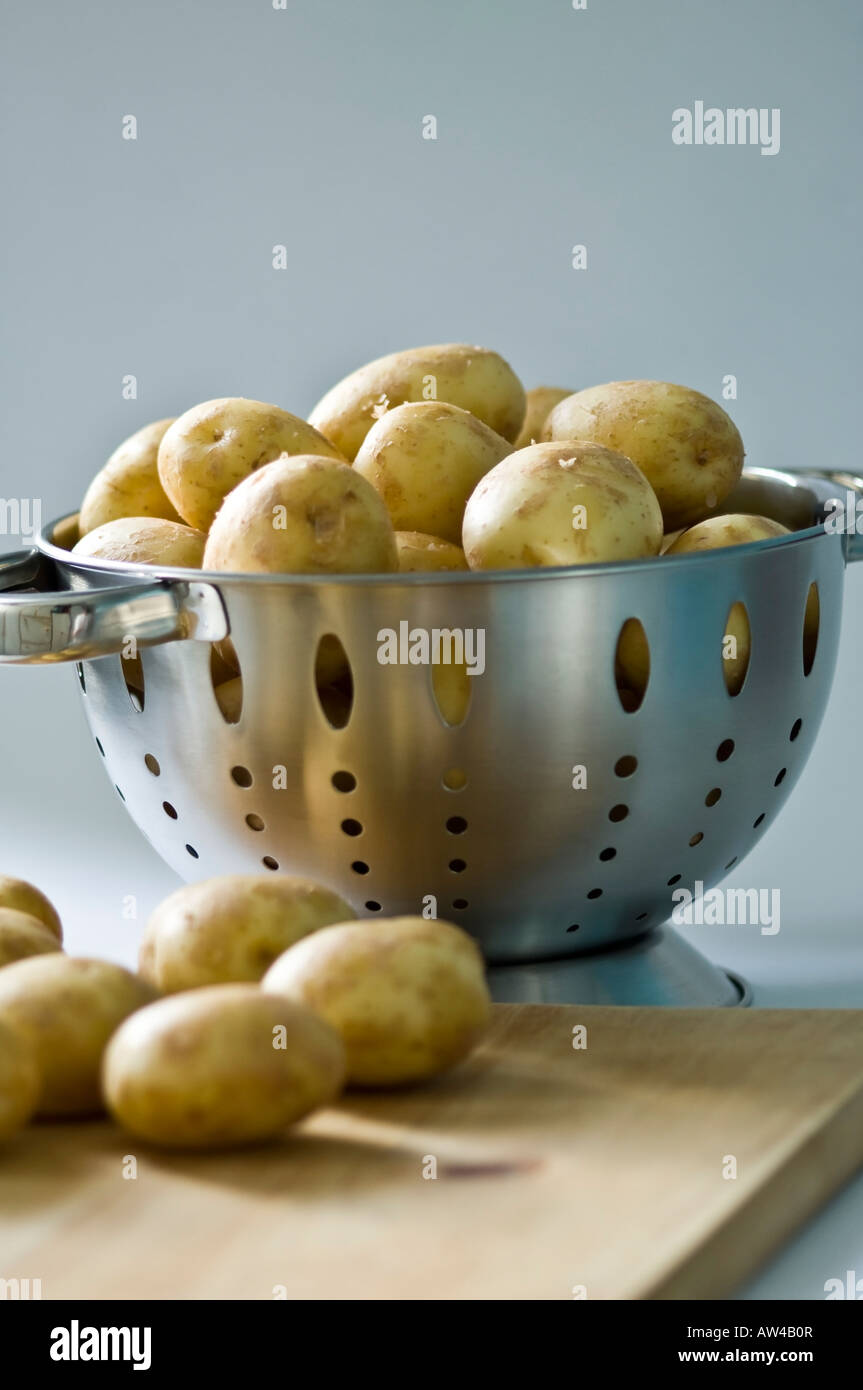 New potatoes in colander food close-up Stock Photo - Alamy