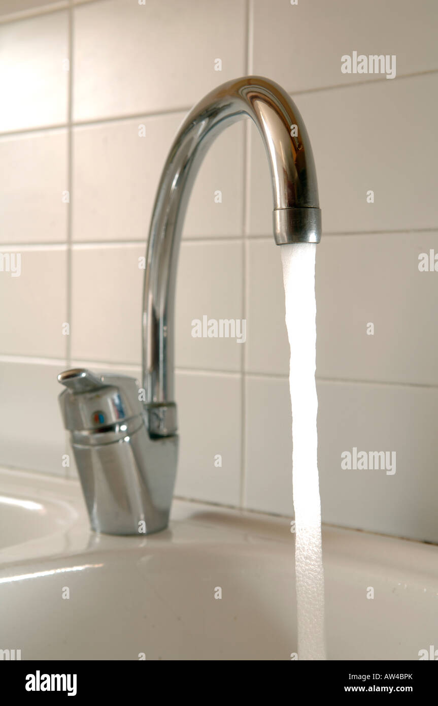 Water running from sink tap Stock Photo - Alamy