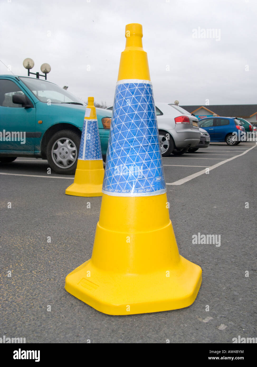 yellow Traffic Cone in car park Stock Photo - Alamy