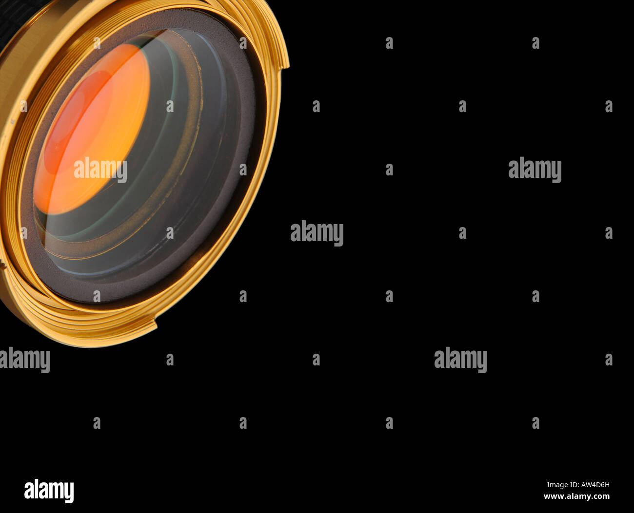 Gold lens over black isolated Stock Photo - Alamy