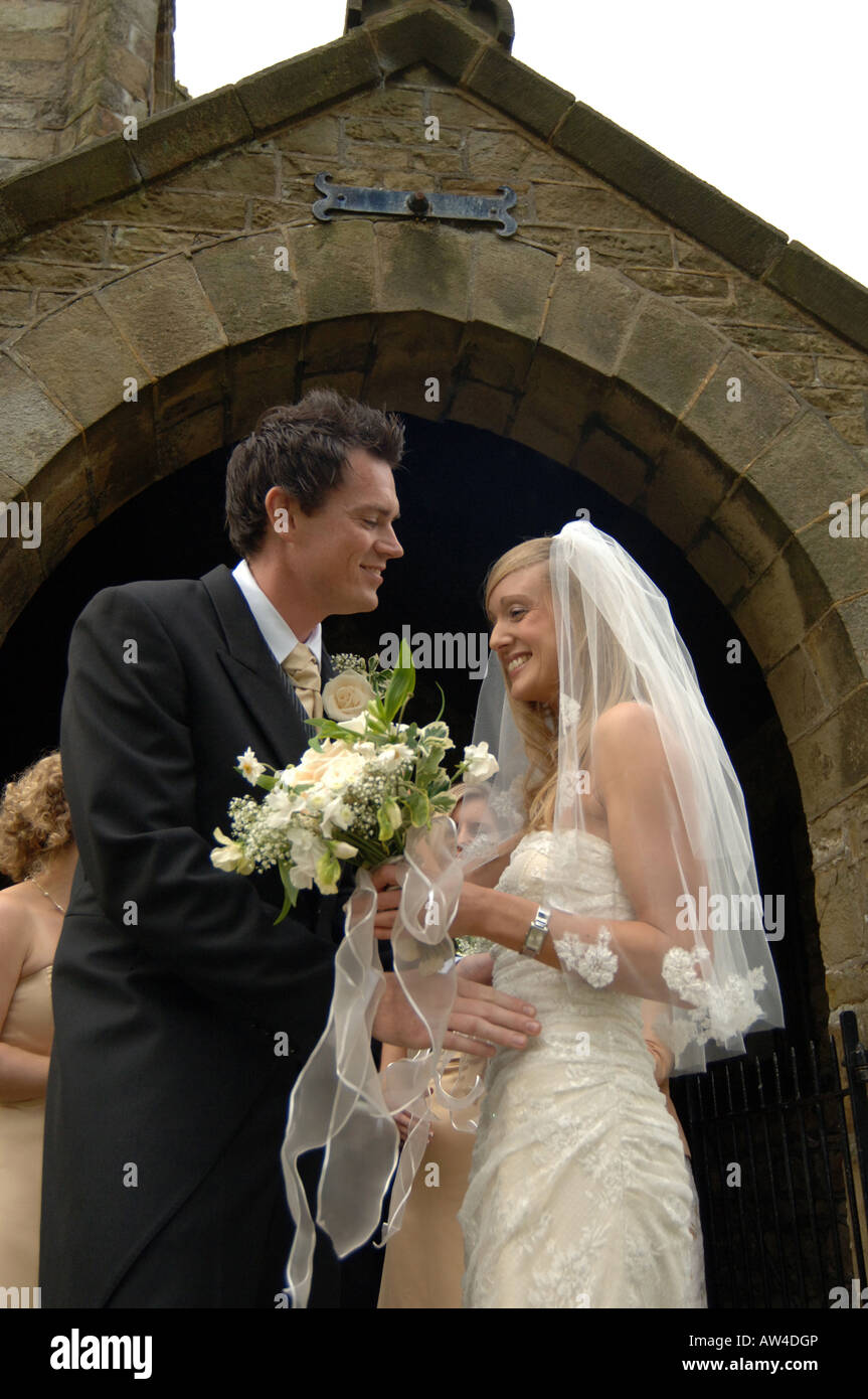 A couple outside the church after getting married Model Released Stock ...
