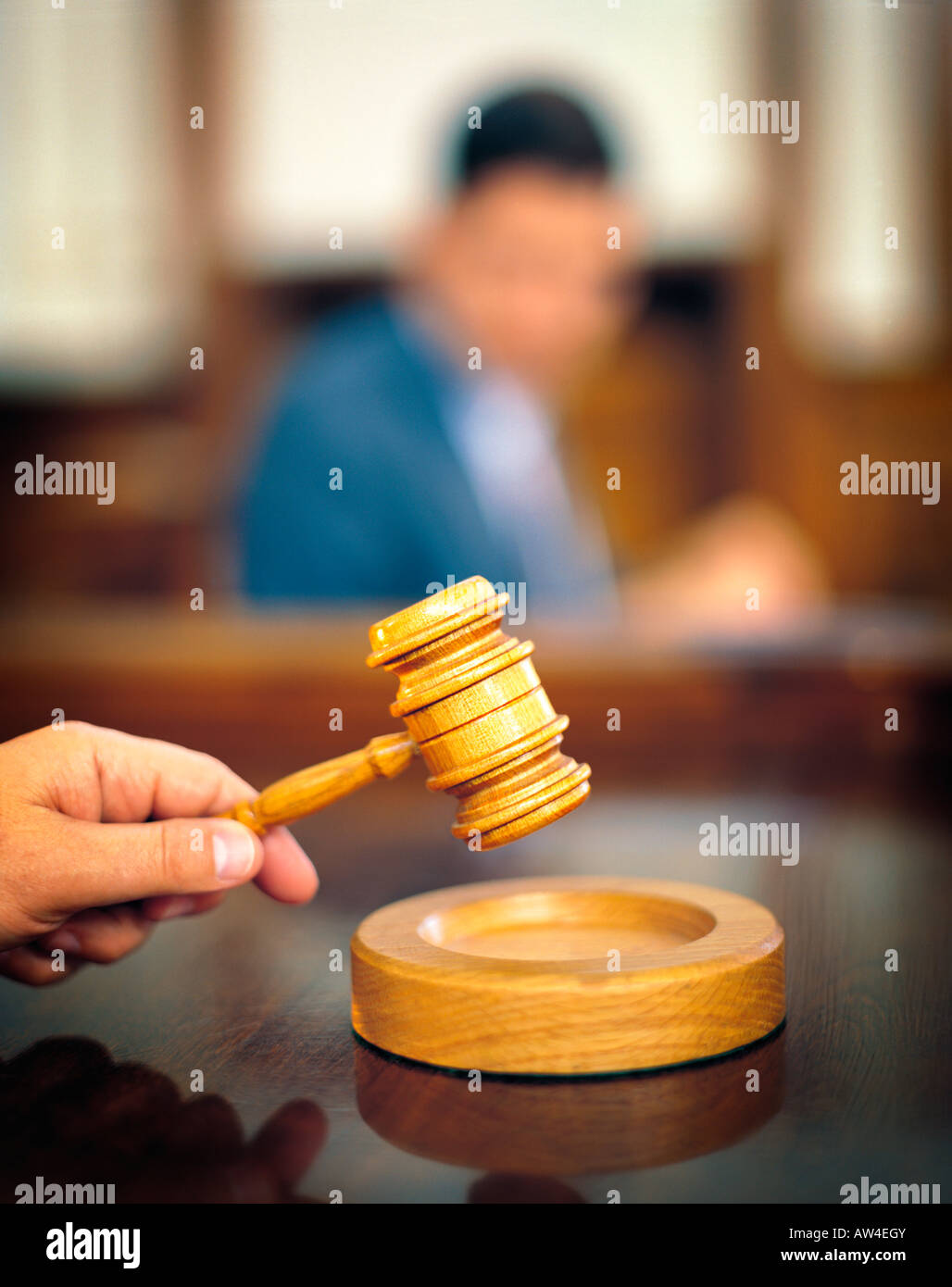 Hand holding a gavel Stock Photo - Alamy