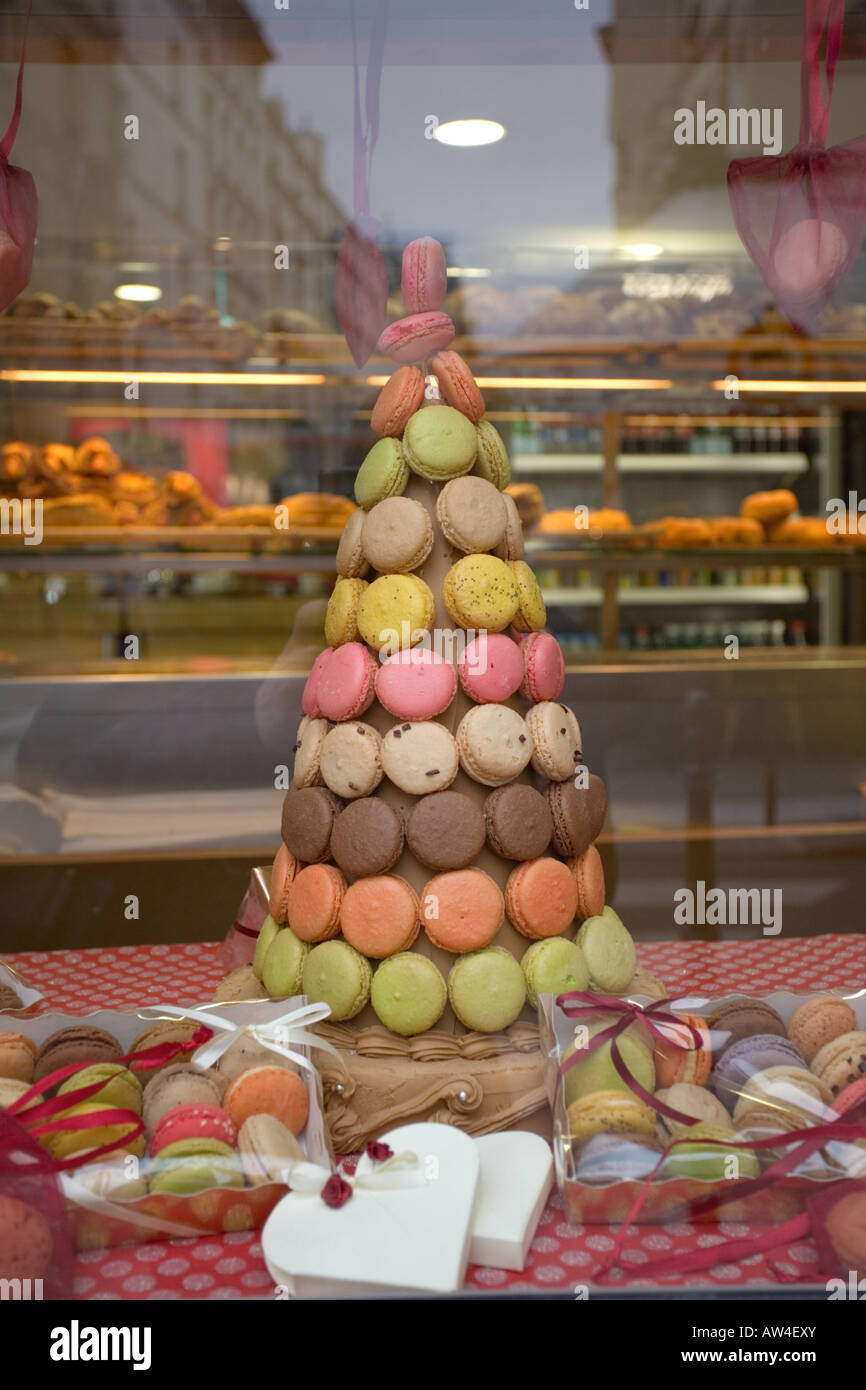 A cone of macaroons in a patisserie shop window in Paris France Stock ...