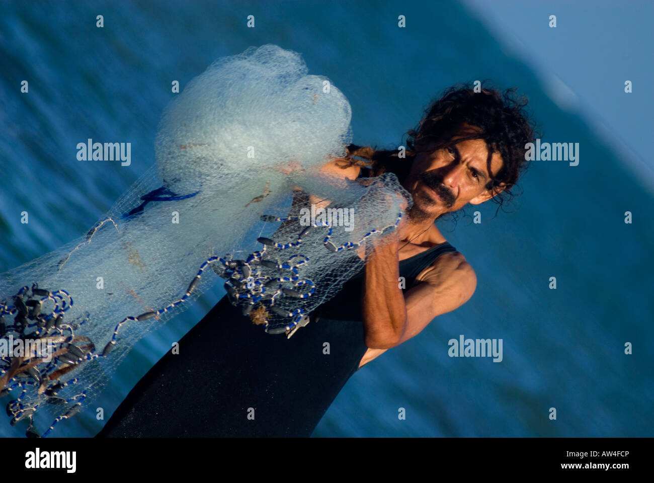 Fisherman With Net Stock Photo - Alamy
