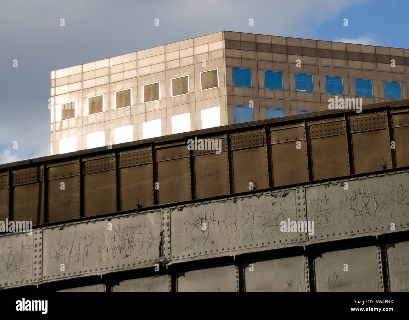 architectural railway bridge with modern square building behind, london ...