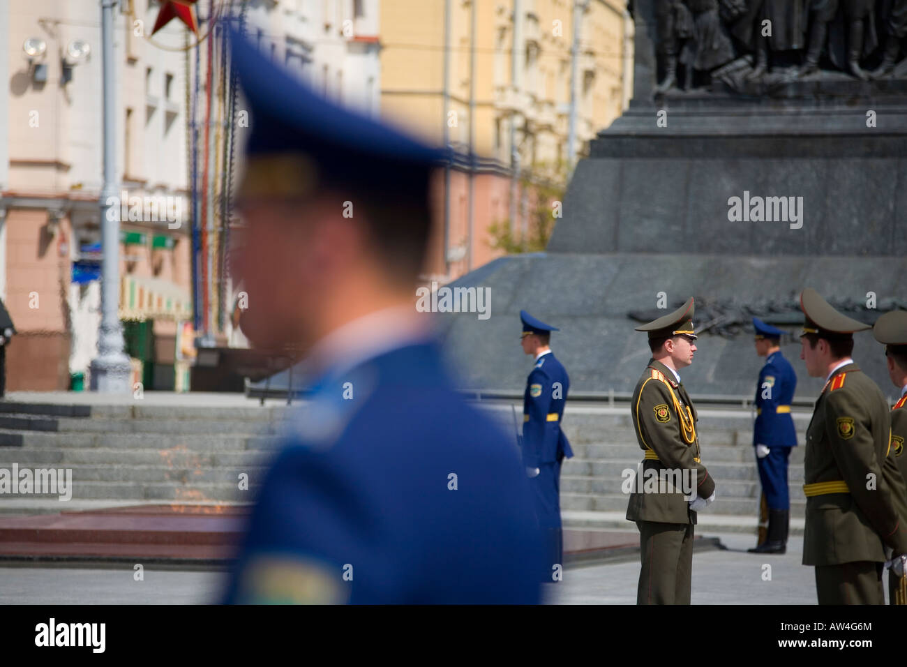 Soldiers standing guard at the war memorial monument in Victory Square ...