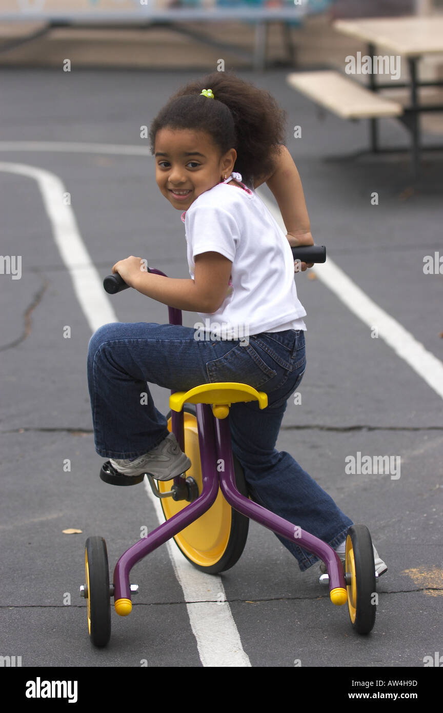 young student on tricycle Stock Photo - Alamy