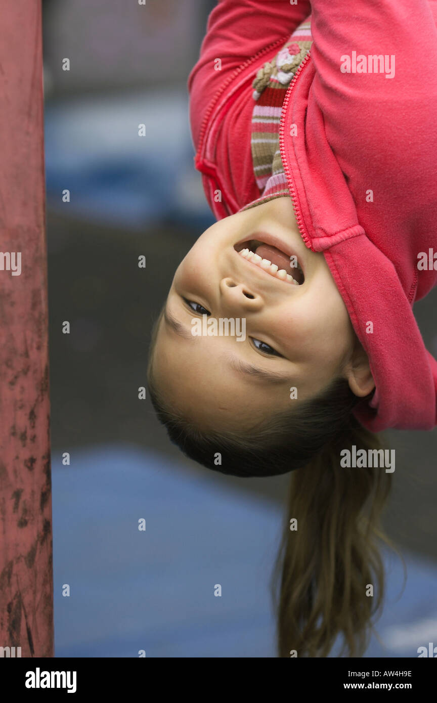 girl hanging upside down Stock Photo - Alamy