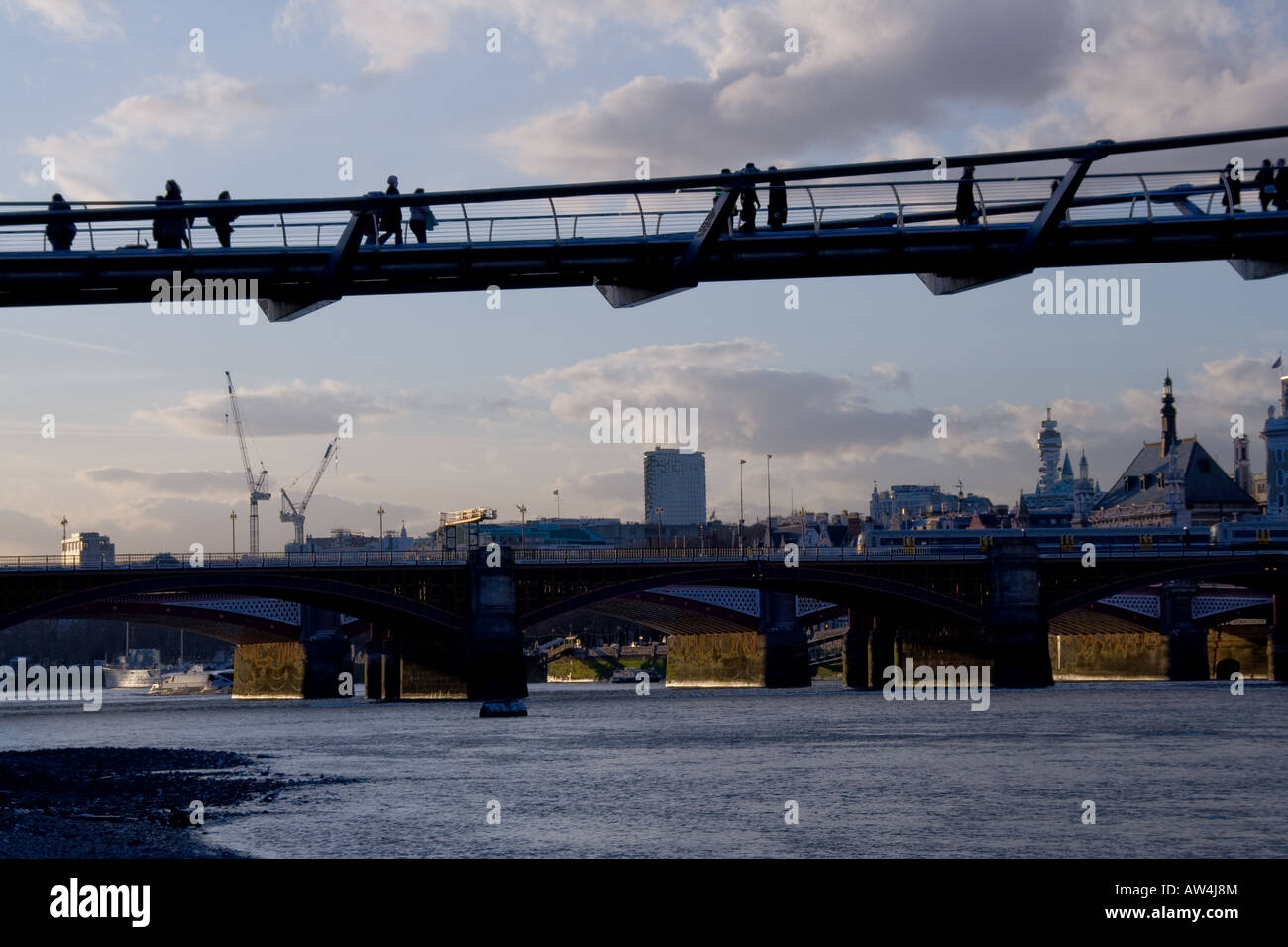 millennium bridge, thames, london at sunset with silhouettes Stock ...