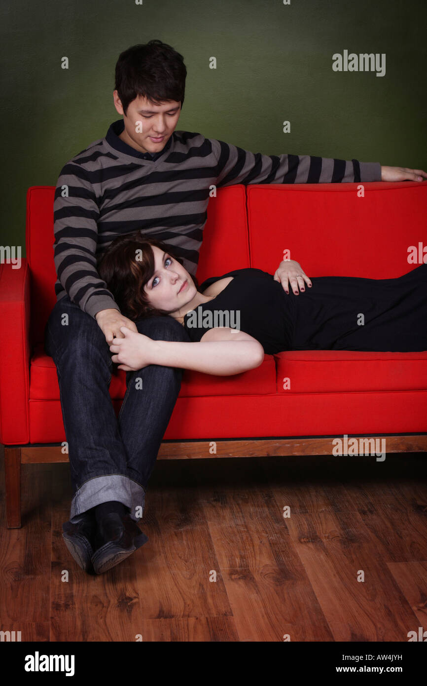 A couple on a couch Stock Photo - Alamy
