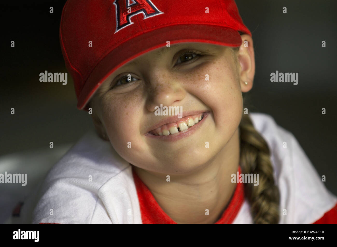Girl baseball cap smiling hi-res stock photography and images - Alamy