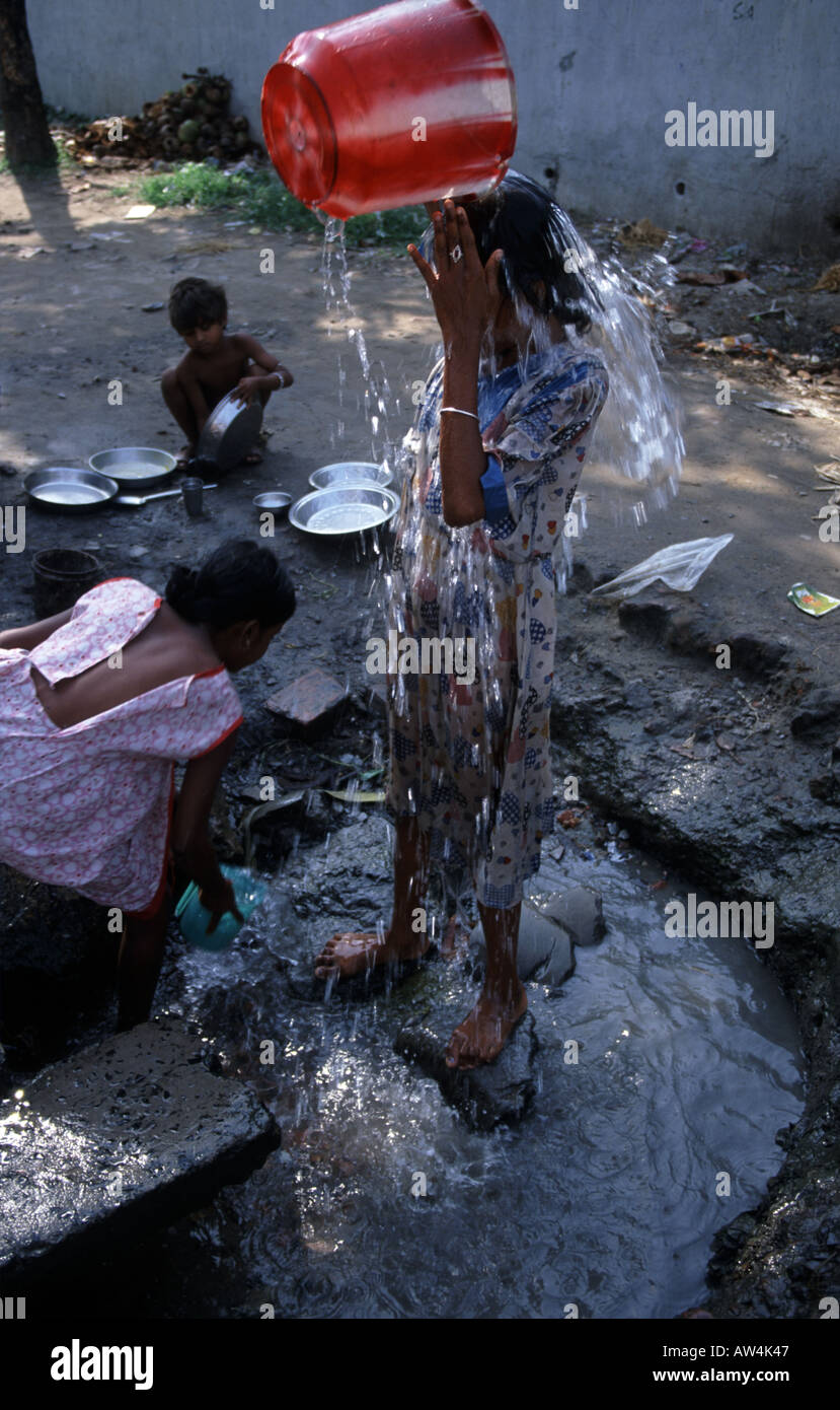 Girl washes using water from a broken standpipe, Kolkata, formerly ...