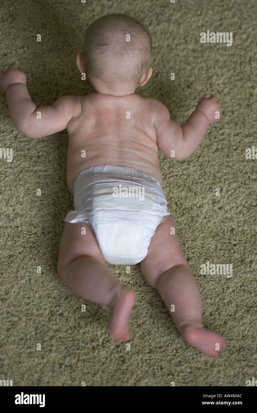 newborn on rug on stomach with diapers Stock Photo - Alamy