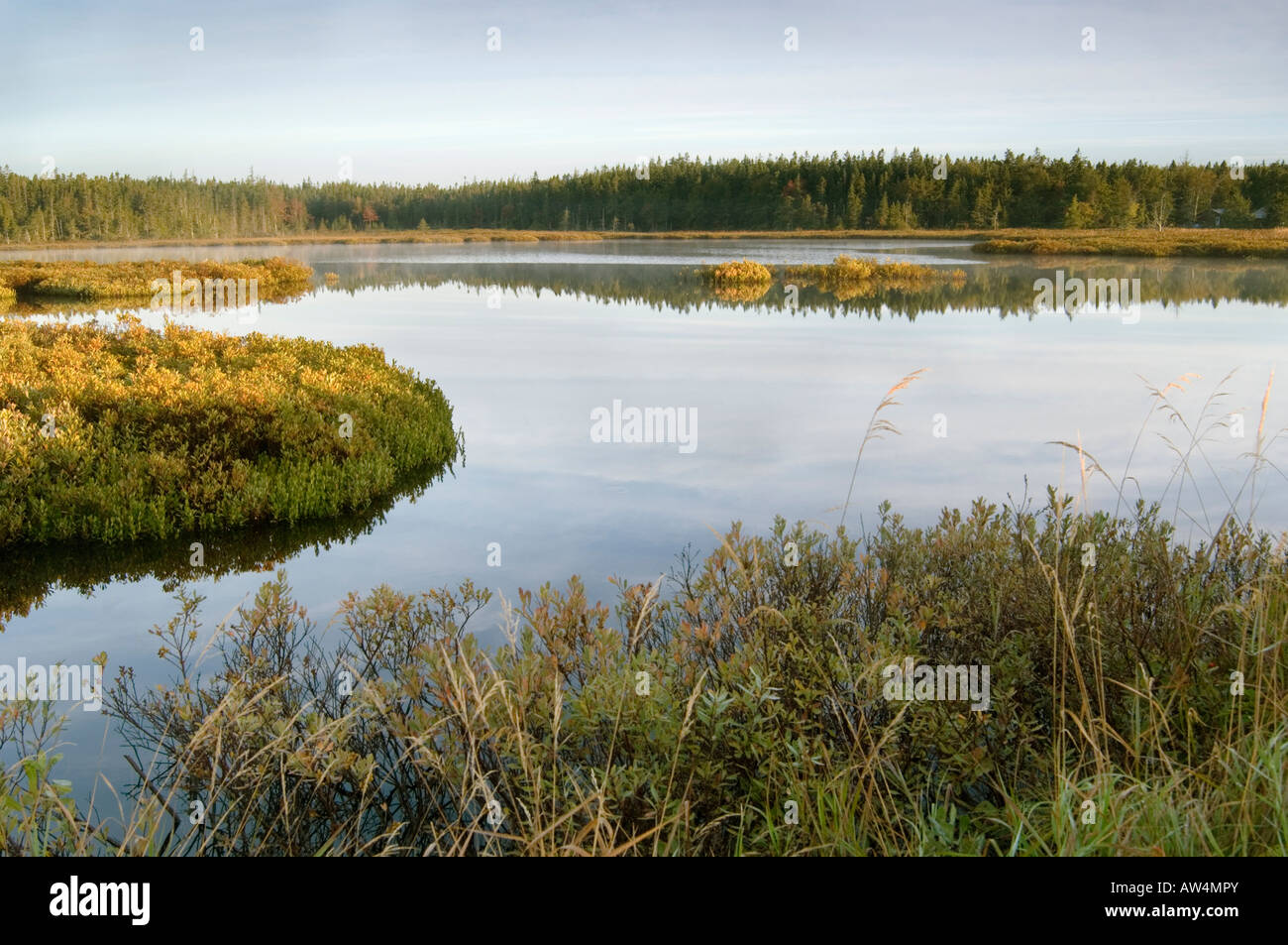 Sunrise facing west over a lake Natural Seawall Acadia National Park ...