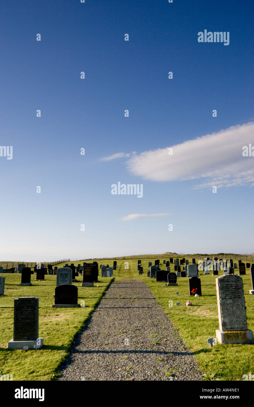 Path through a cemetery graveyard with clear blue skies ahead Stock ...
