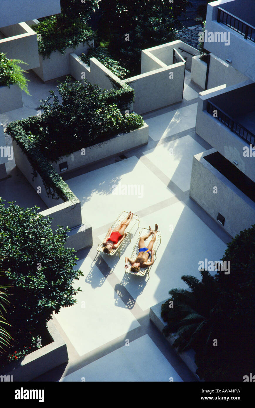 Romantic couple laying in sun, tanning together, Miami Stock Photo - Alamy