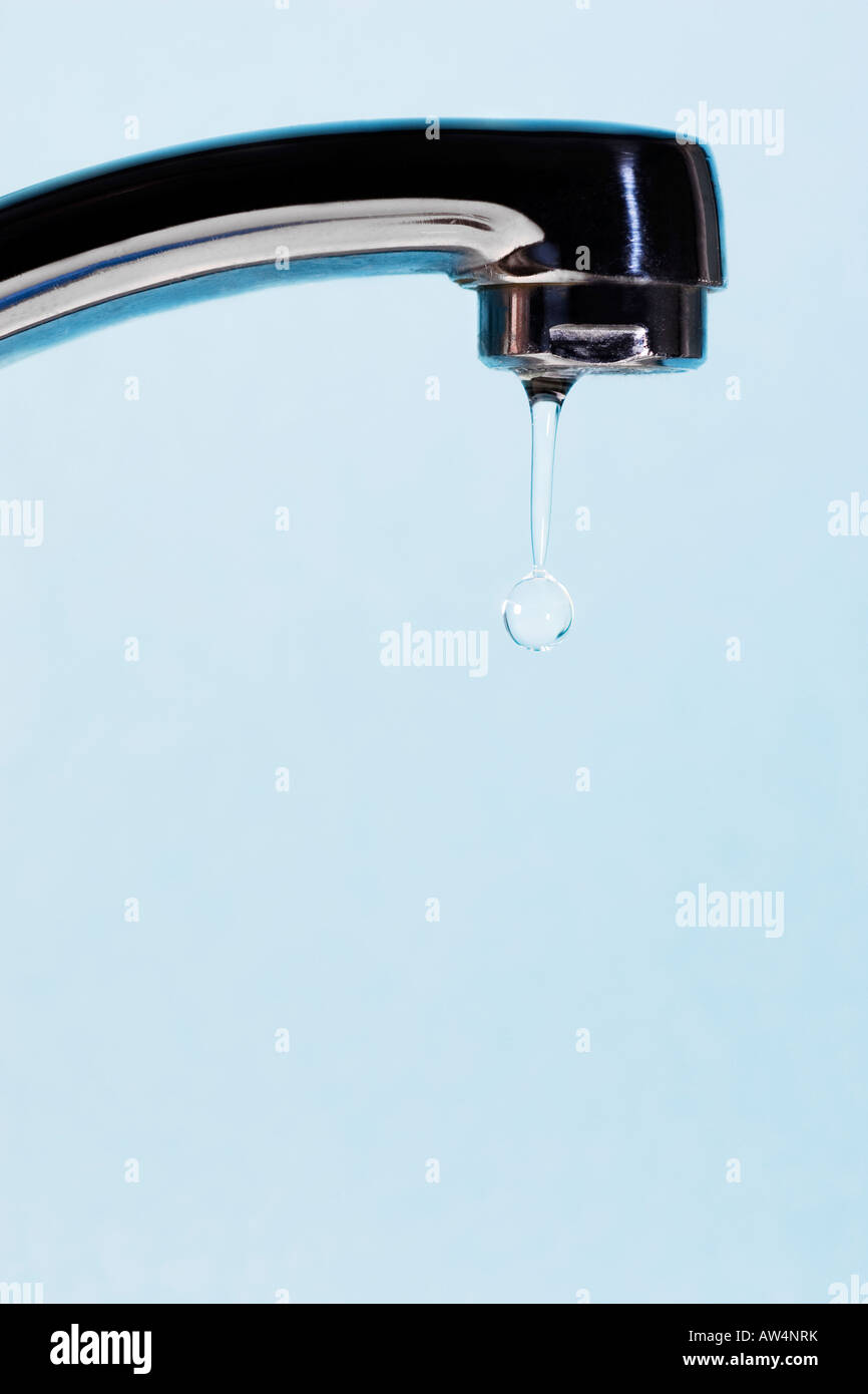 Water droplet dripping from a steel tap Stock Photo - Alamy