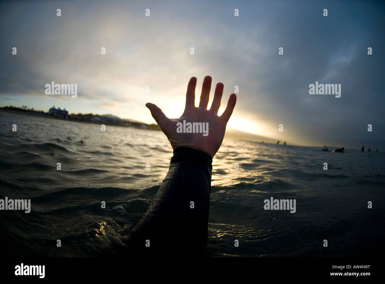 A hand coming out of the ocean Stock Photo - Alamy