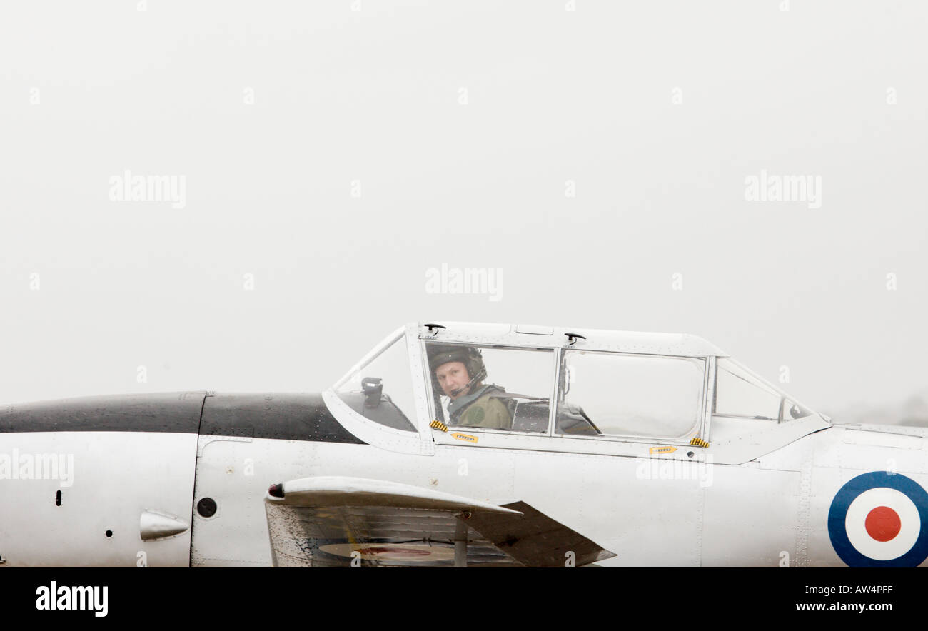 Pilot peering from the cockpit of a Hurricane WWII WW2 fighter plane ...