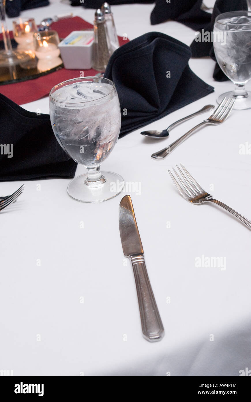 Table placement of utensils with white napkins Stock Photo - Alamy