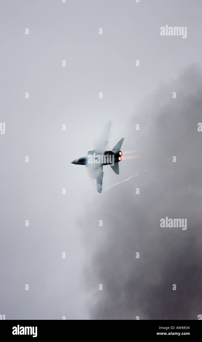 Tornado GR4 fighter jet with vapour trail flying through bomb smoke ...
