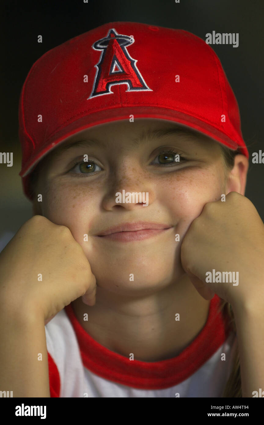 girl with baseball cap with hands on cheeks Stock Photo - Alamy