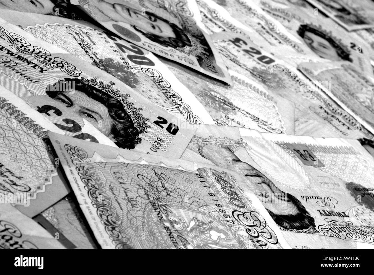 black and white shot of 20 and 50 pound notes laid on a surface Stock ...