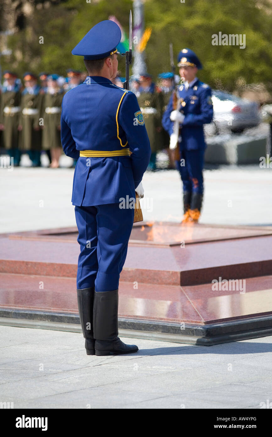 Soldiers standing guard at the war memorial monument in Victory Square ...