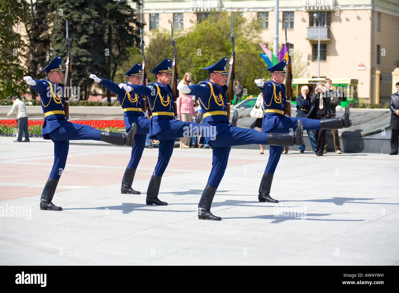 Soldiers goose stepping at the war memorial monument in Victory Square ...
