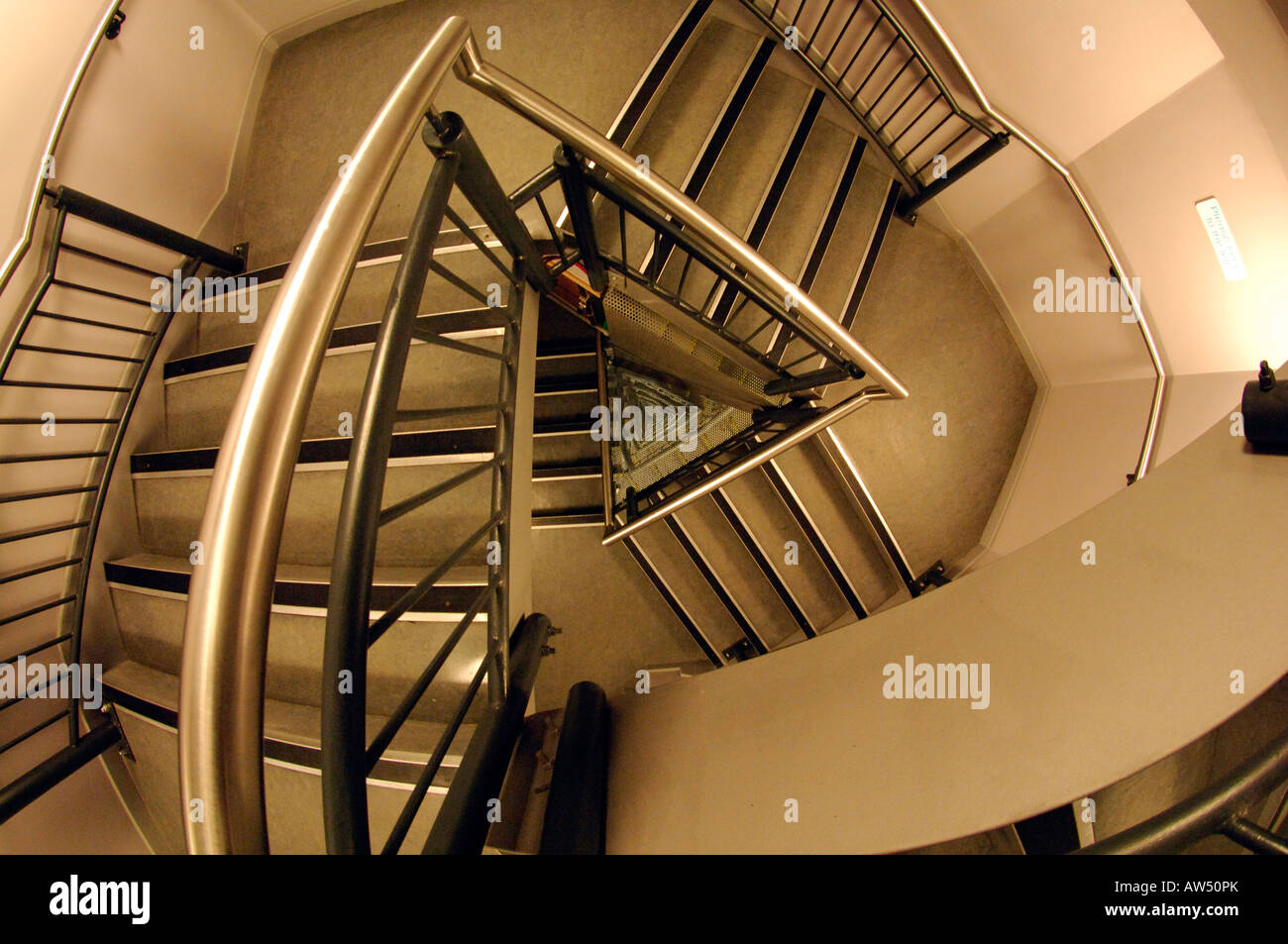 a modern staircase stairwell well spiraling looking down through the ...