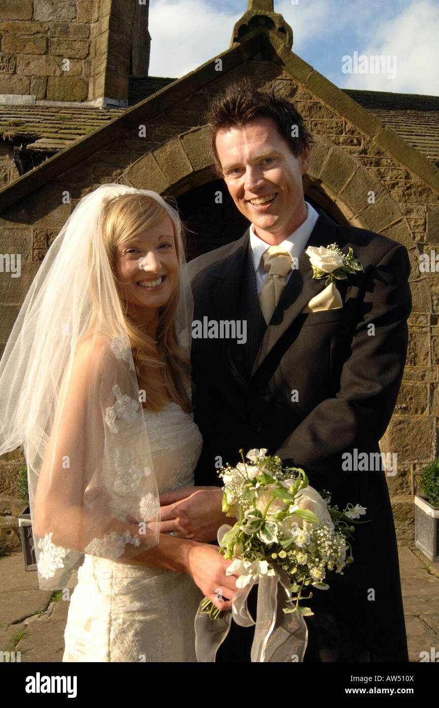 A couple outside the church after getting married Model Released Stock ...