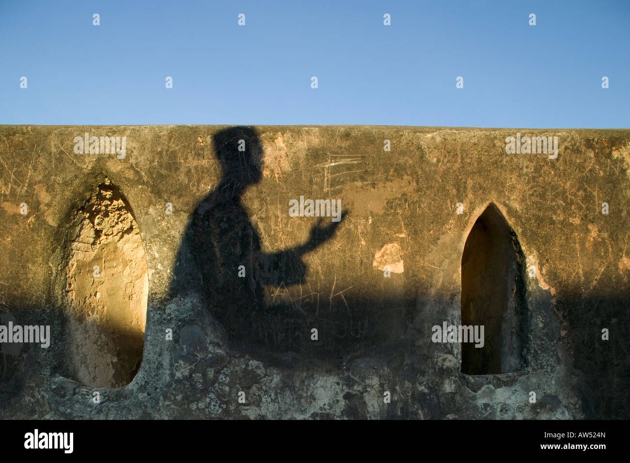 Africa Kenya Mombasa Shadow cast by tourist guide on fort walls inside ...