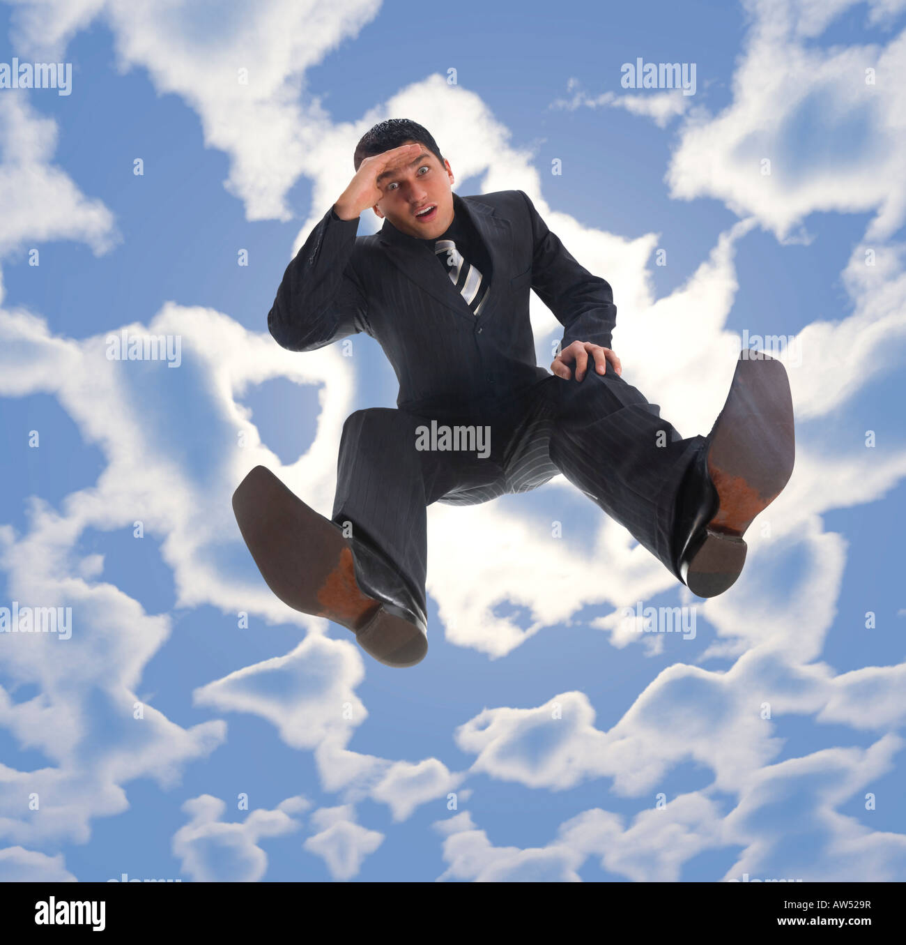 Young surprised businessman looking at camera Low angle view Stock ...