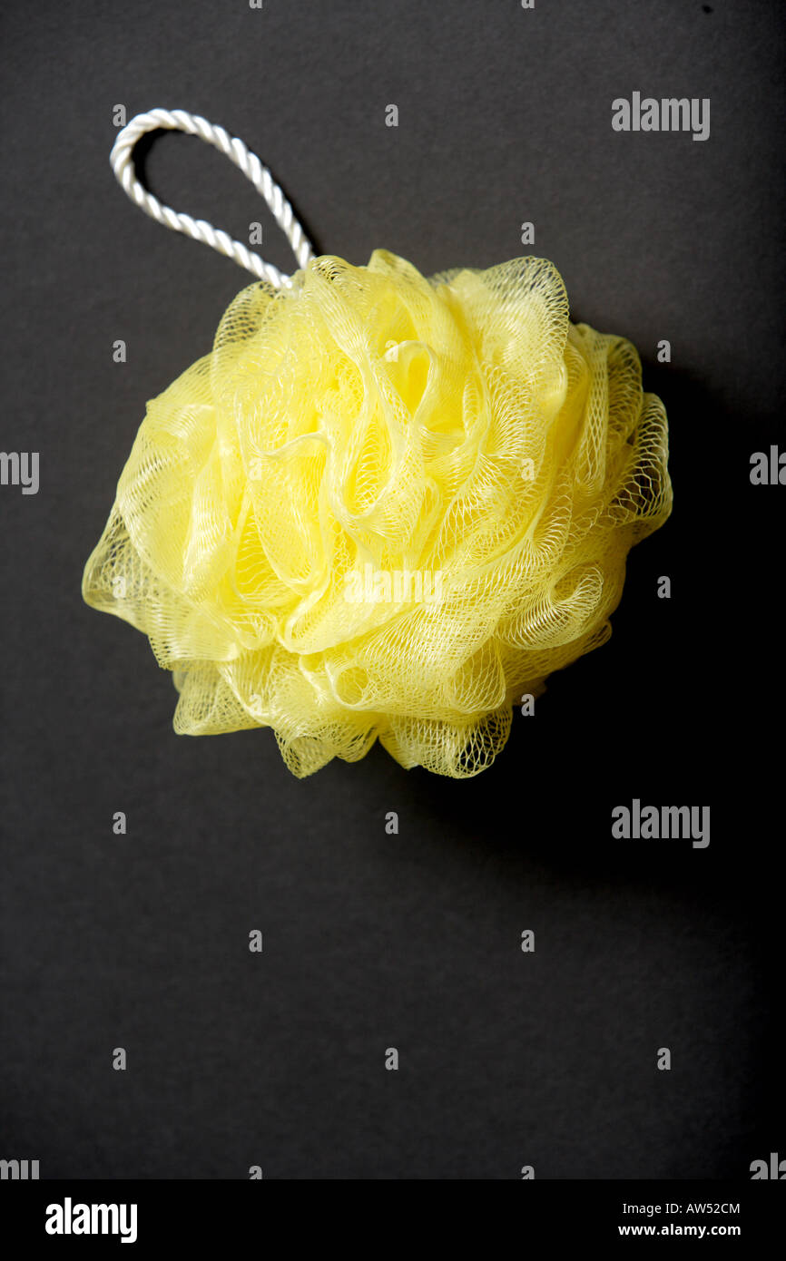 A yellow lufa on a black background Stock Photo - Alamy