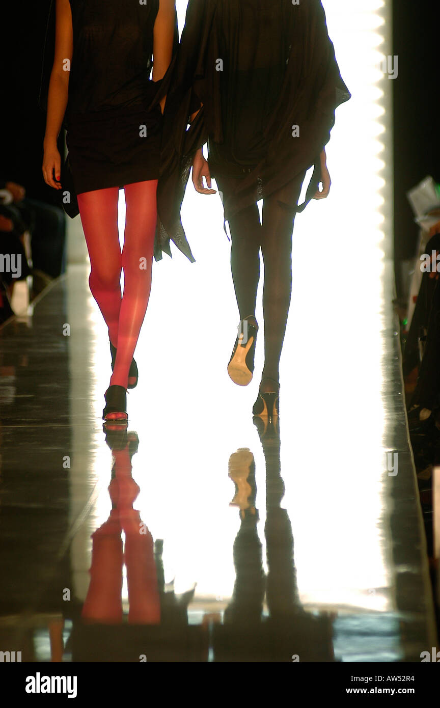 A pair of models legs walking up and down a shiny catwalk Stock Photo ...
