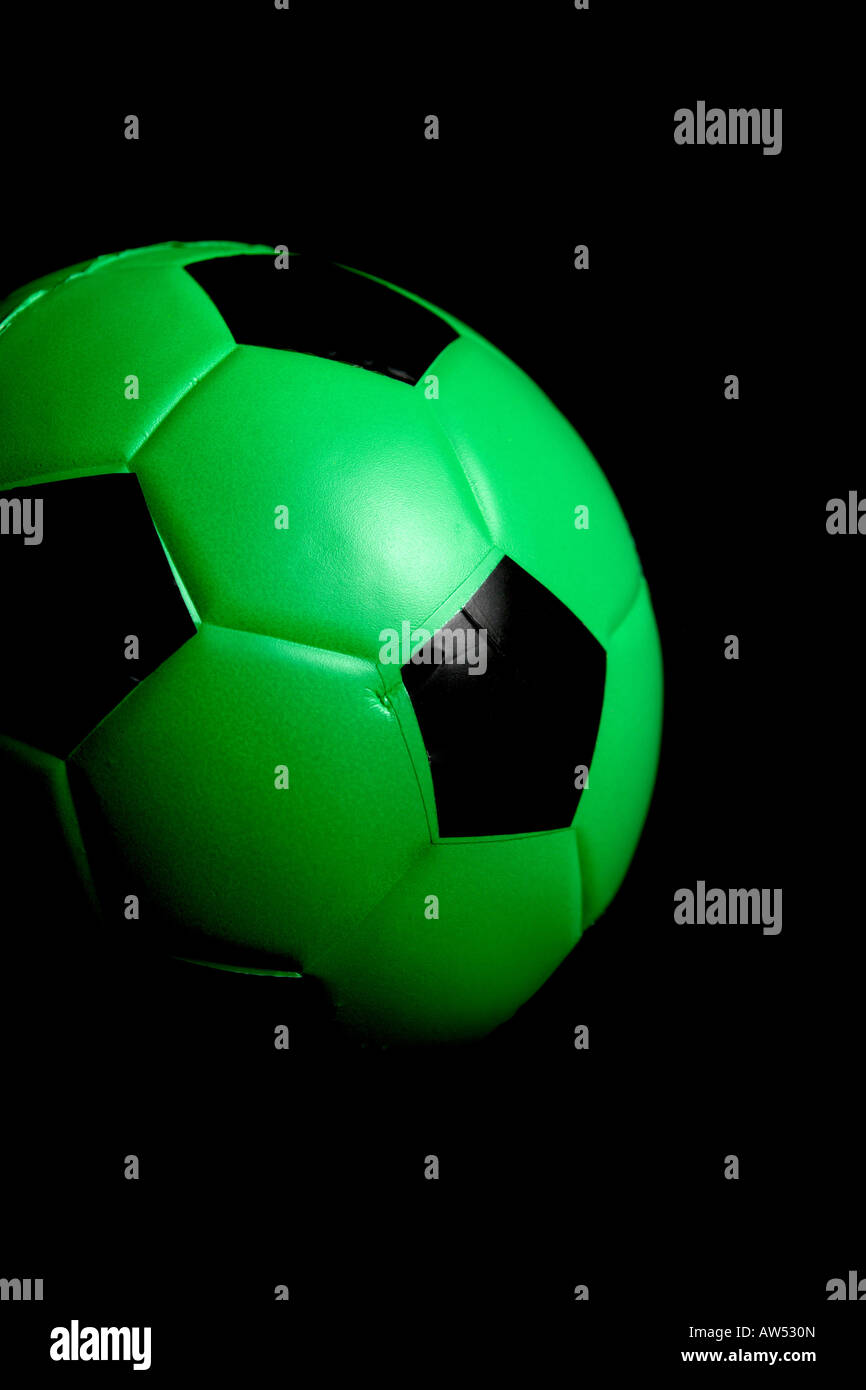 A green Soccer ball in the studio Stock Photo - Alamy