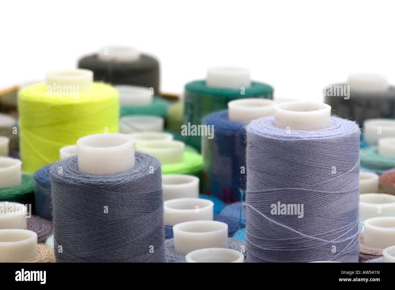object on white spool of thread Stock Photo - Alamy
