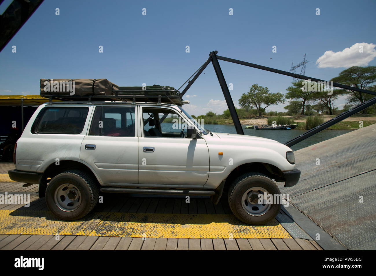 Africa Botswana Kasane Toyota Land Cruiser is carried aboard river ...