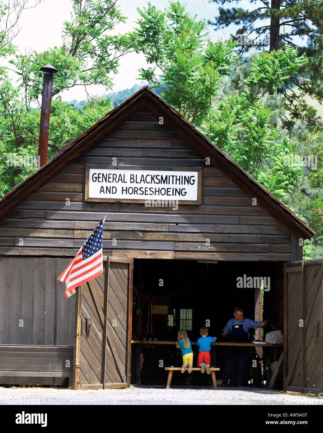 Children looking at goldsmiths bench in the town of Coloma Stock Photo ...
