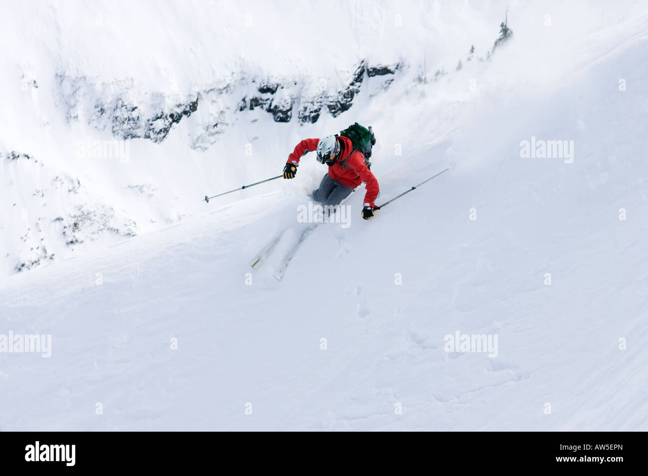 Skier on ridge line in remote canyon near Telluride ski area, San Juan ...