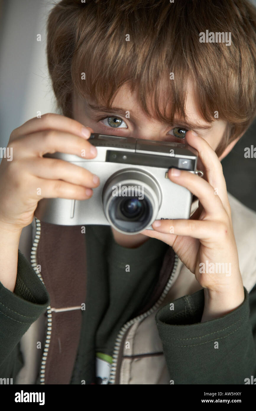 child holding a camera and taking a picture inside Stock Photo - Alamy