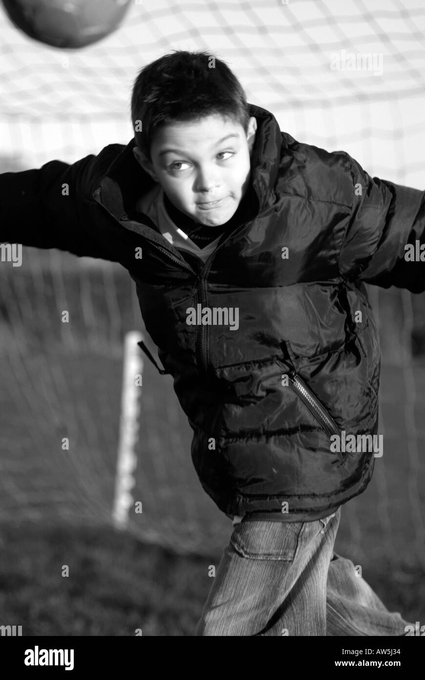 Child football heading ball Black and White Stock Photos & Images - Alamy